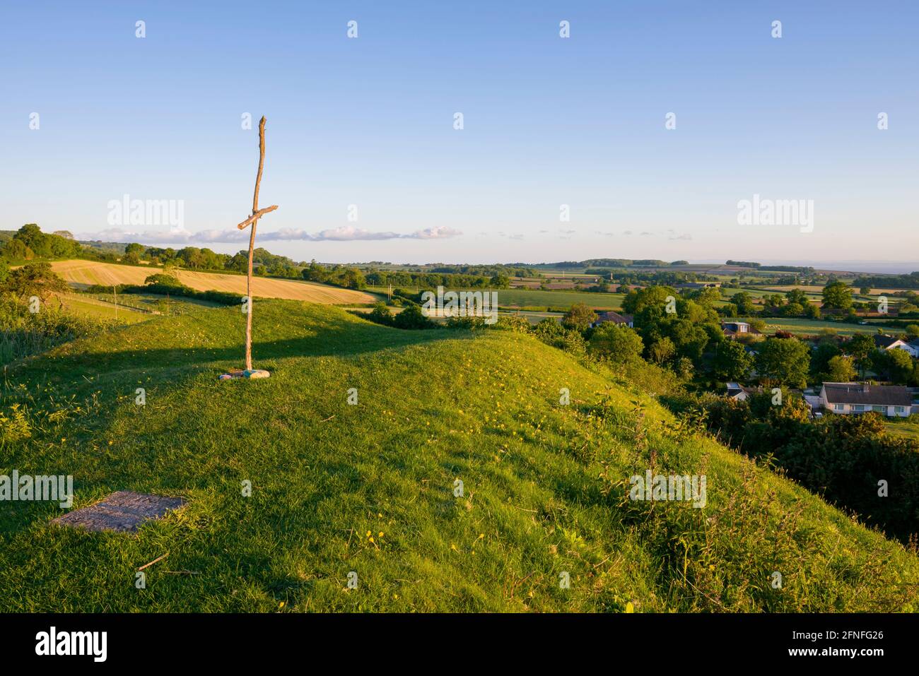 A wooden cross on the Norman motte-and-bailey Stowey Castle at foot of ...