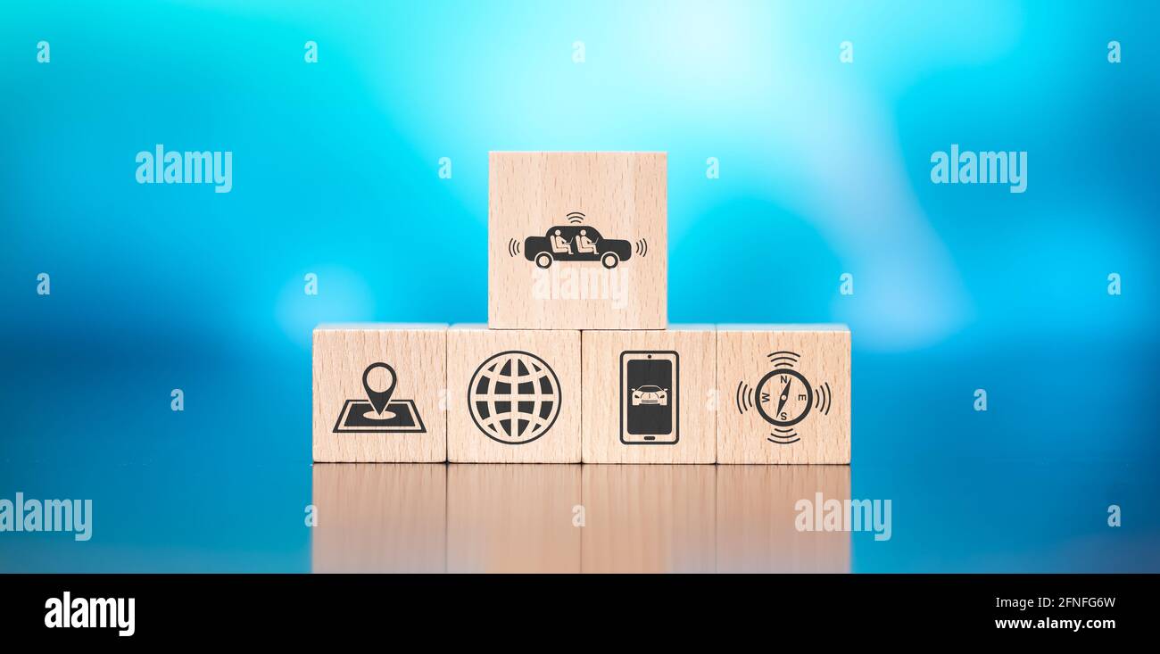 Wooden blocks with symbol of autonomous vehicle concept on blue ...