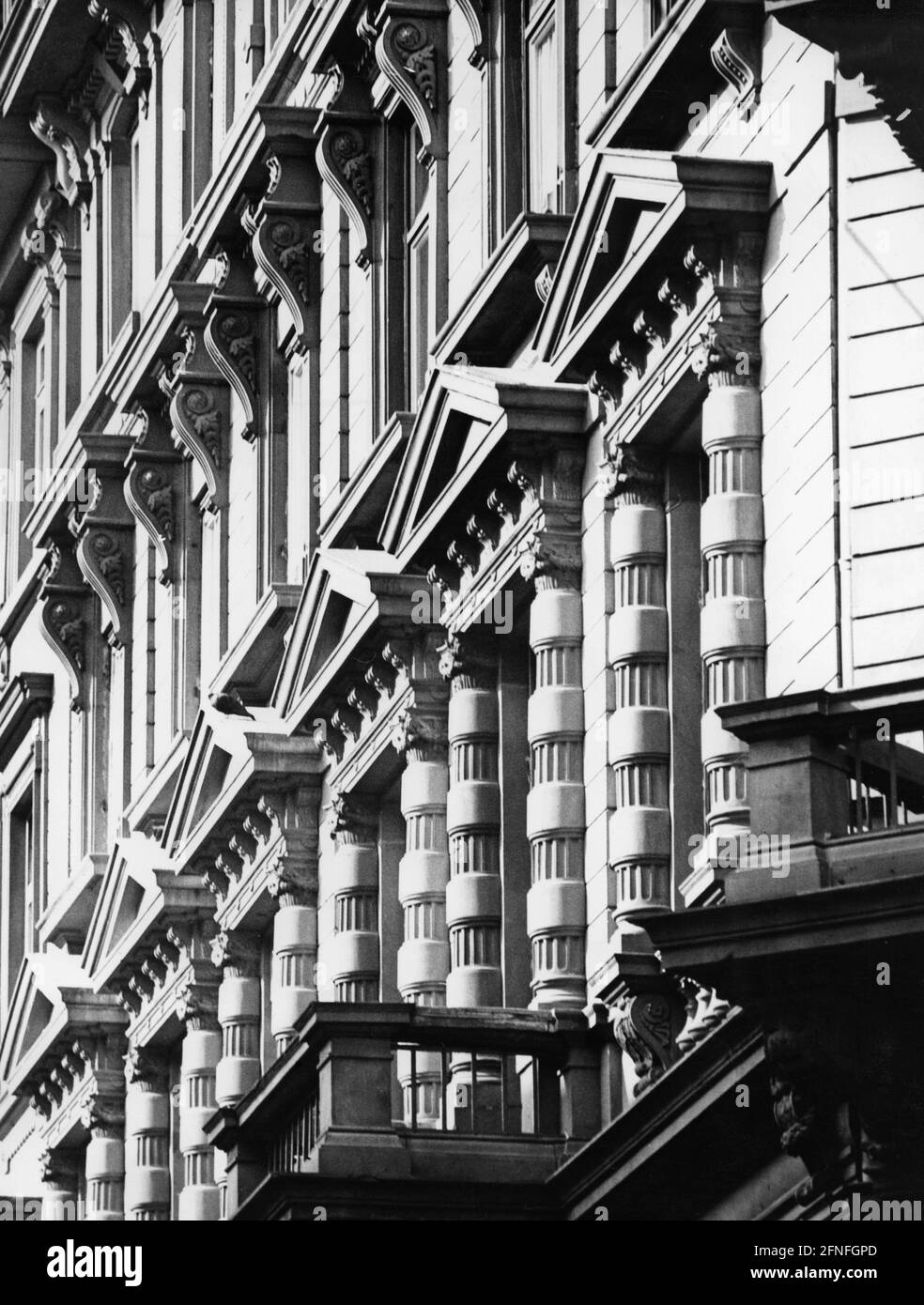Elaborate house facade with columns, gibs and balconies from the 70s of ...