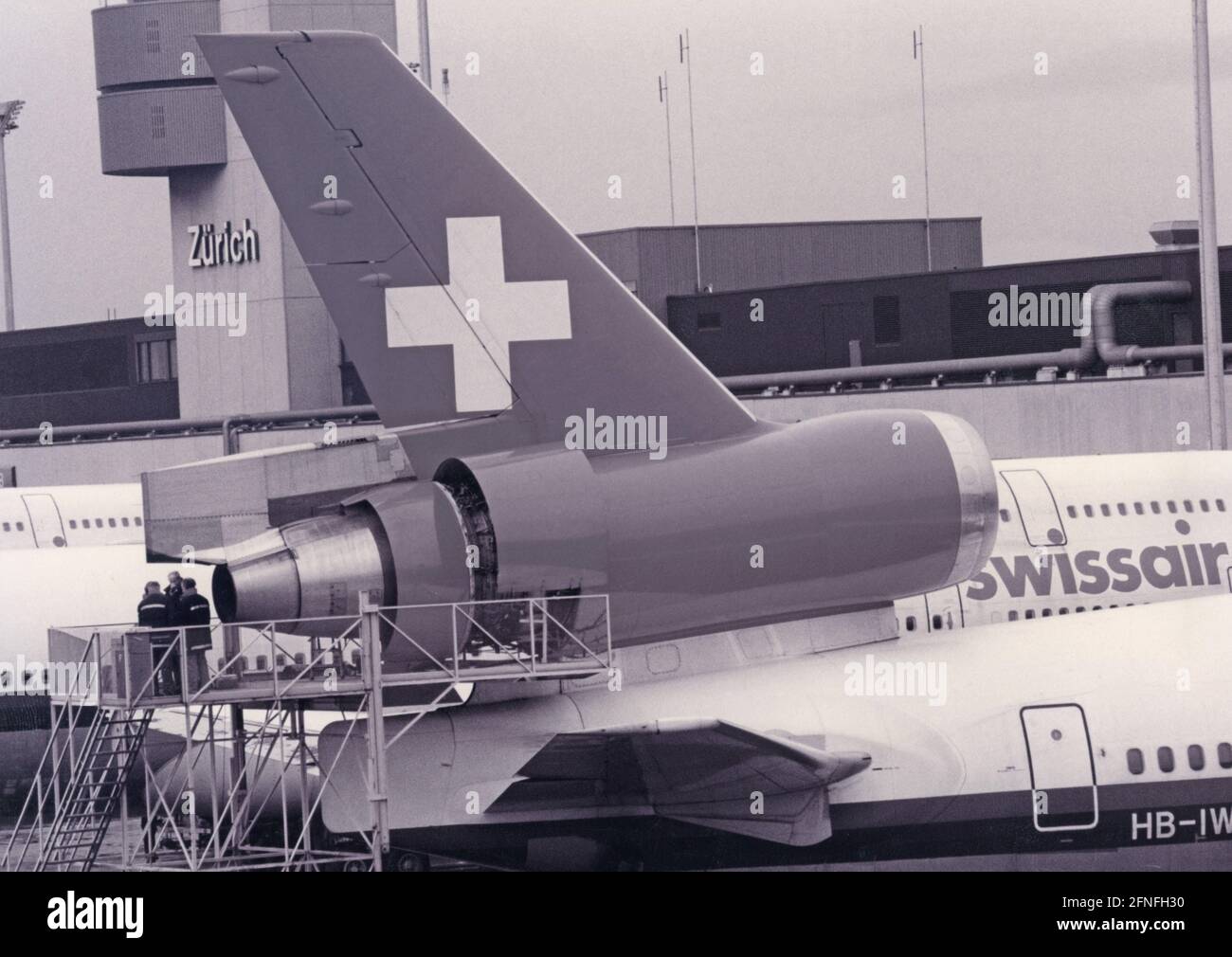 Maintenance work on the third engine of a McDonnell douglas MD-11 of ...