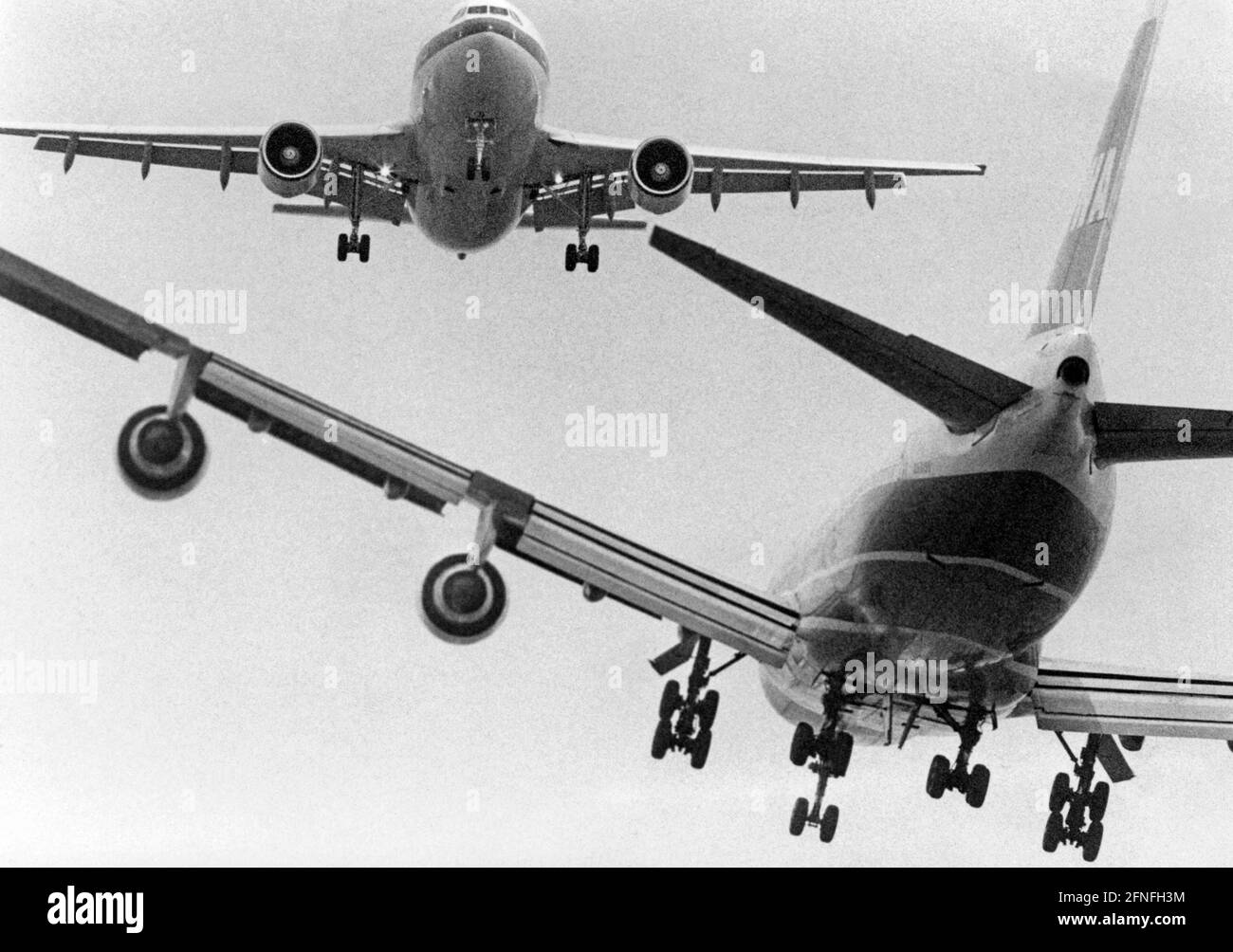A double exposure photo shows an Airbus A300 and a Boeing 747 of TWA ...