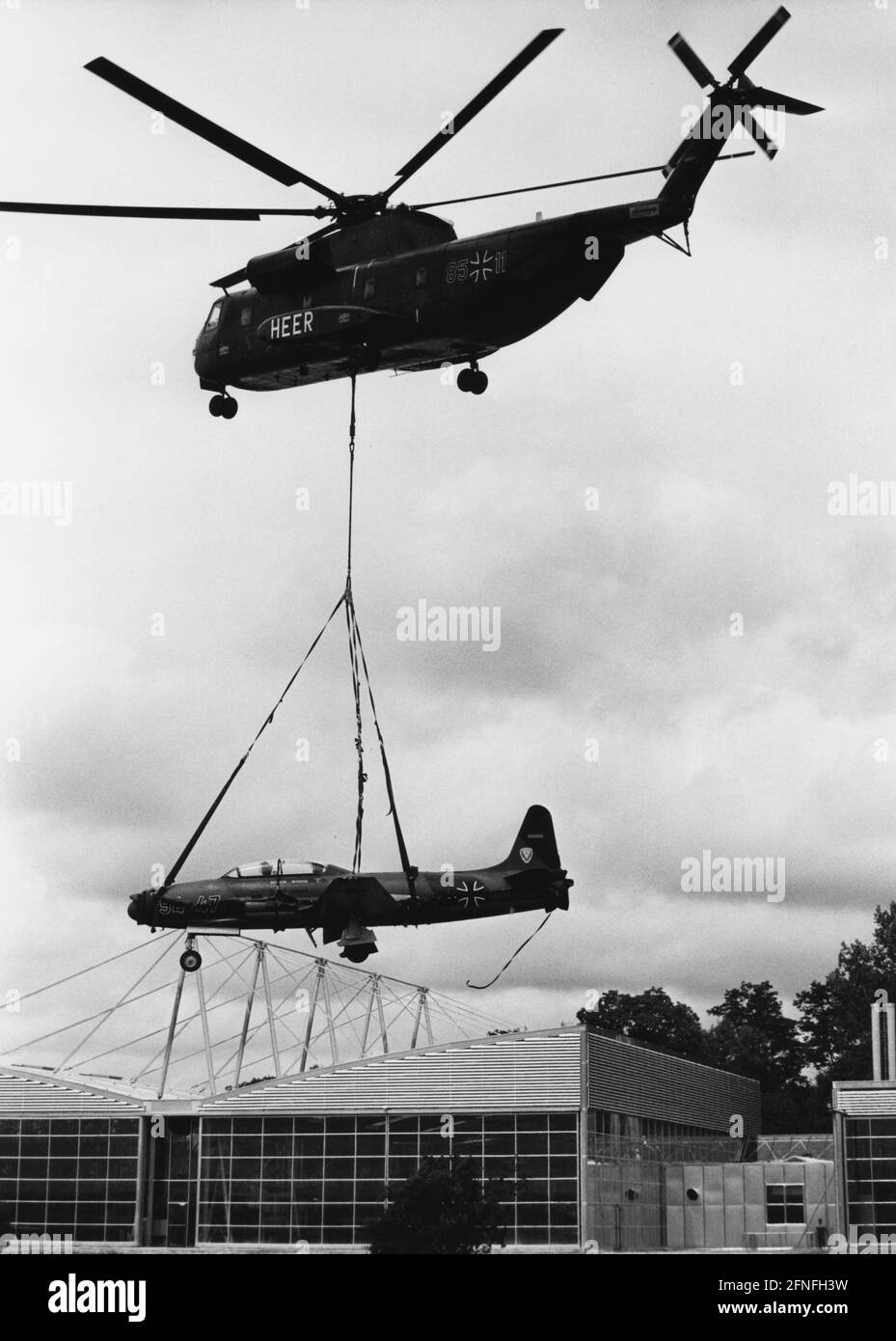 A Bundeswehr transport helicopter brings a Lockheed T-33 to the new ...
