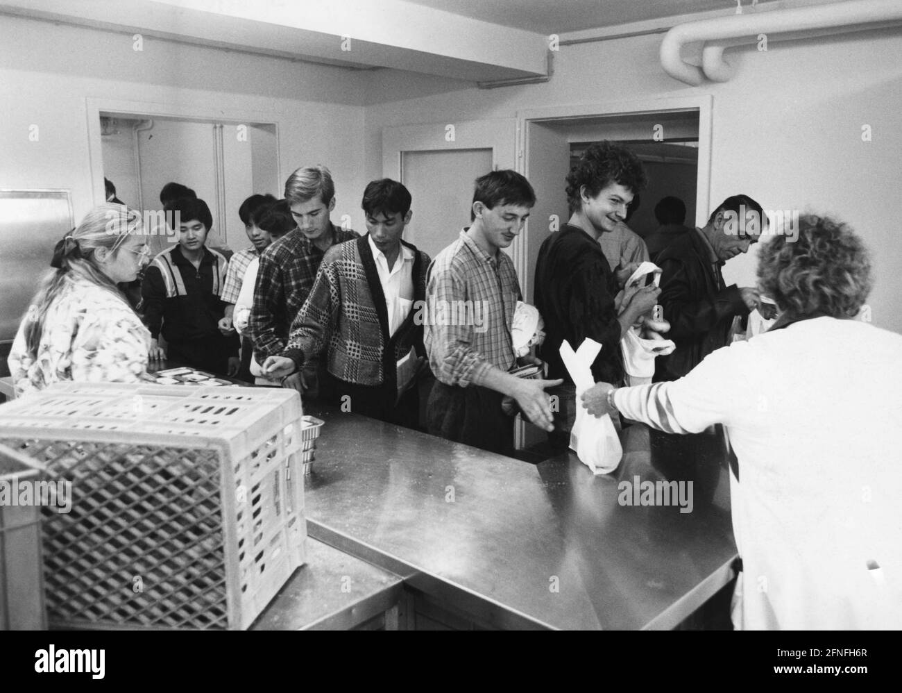 Asylum seekers are served their food in the dormitory in Munich's ...