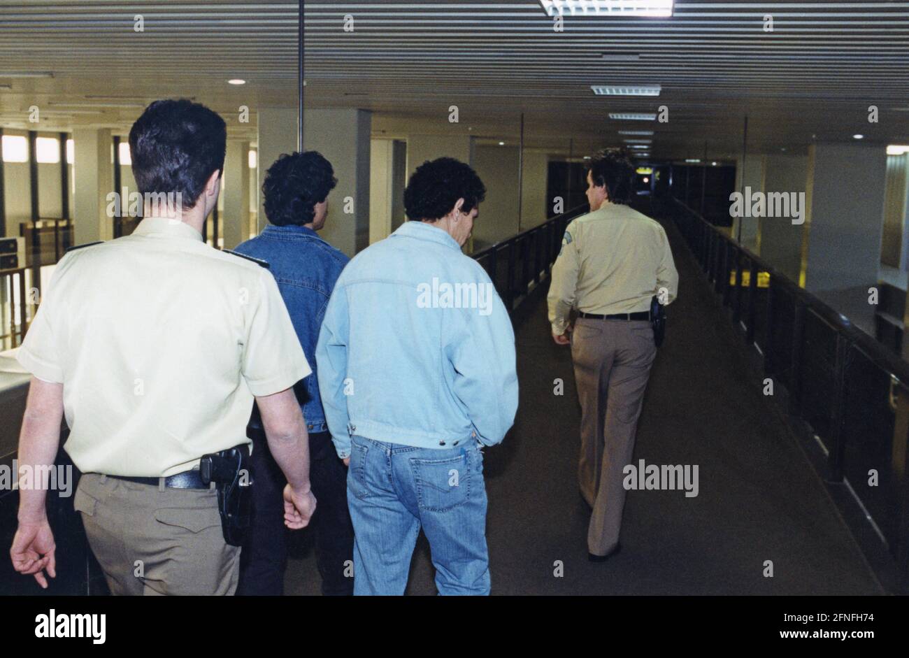 Officers of the Federal Border Police carry out the deportation of two ...