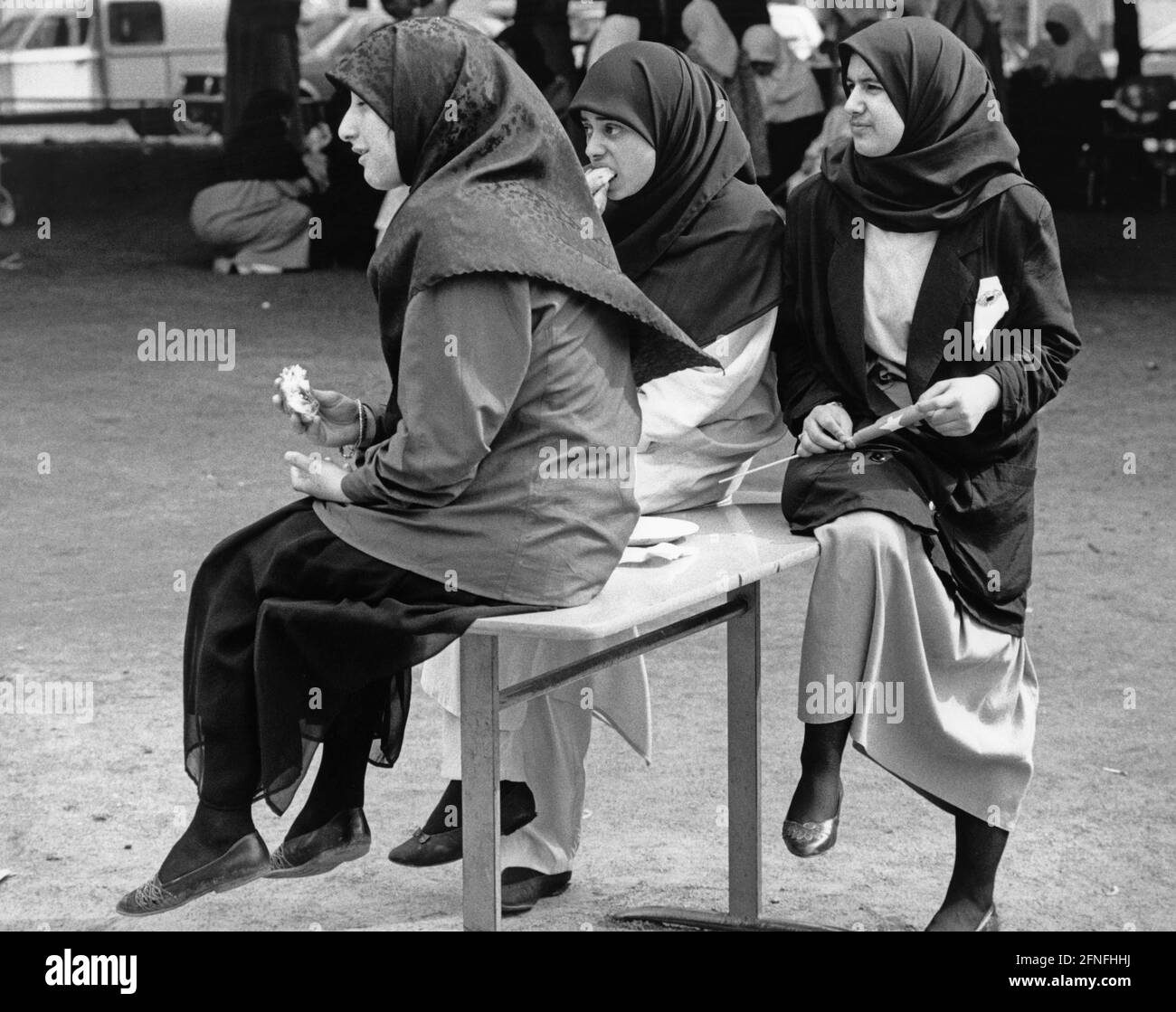 Three young women with a migration history in Görlitzer Park in Berlin ...