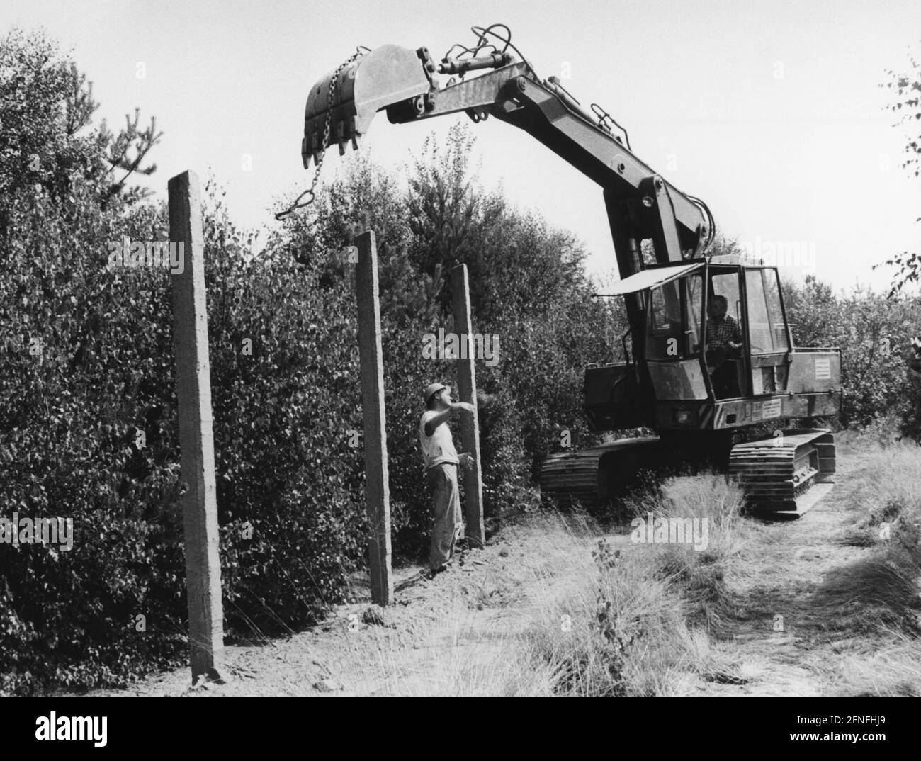 Excavator shovels dig at the former inner-German border. The border ...
