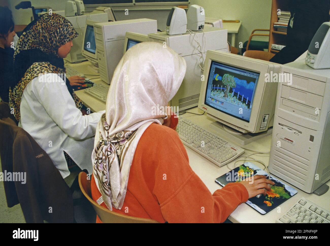 Muslim schoolgirls are trained in the use of computers. [automated ...