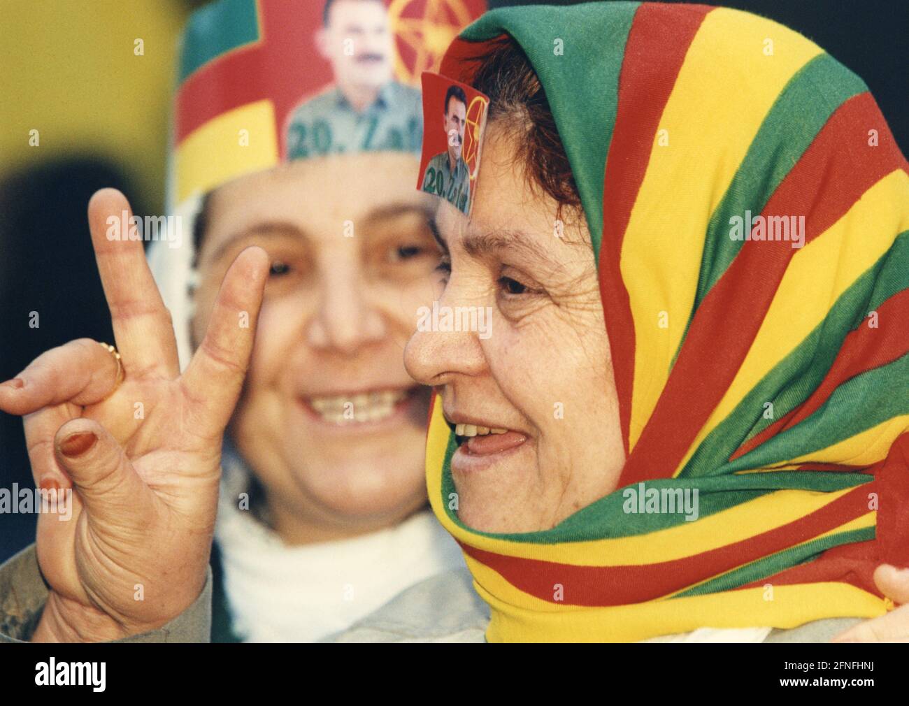 A Kurdish woman shows the Victory sign during a demonstration for the ...