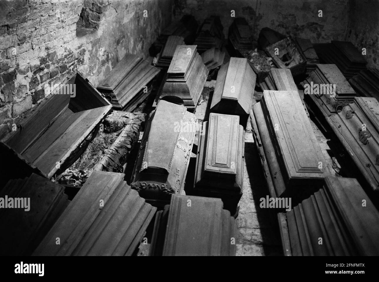 mummified corpse of a child in a coffin in the crypt under the ...