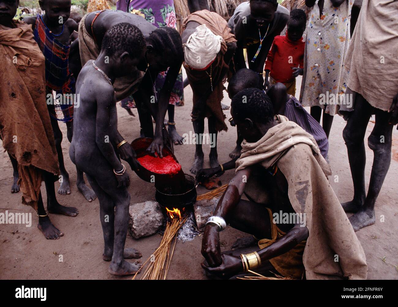 SDN , SUDAN : People in Waat ( South Sudan ) boil the blood of a cow ...
