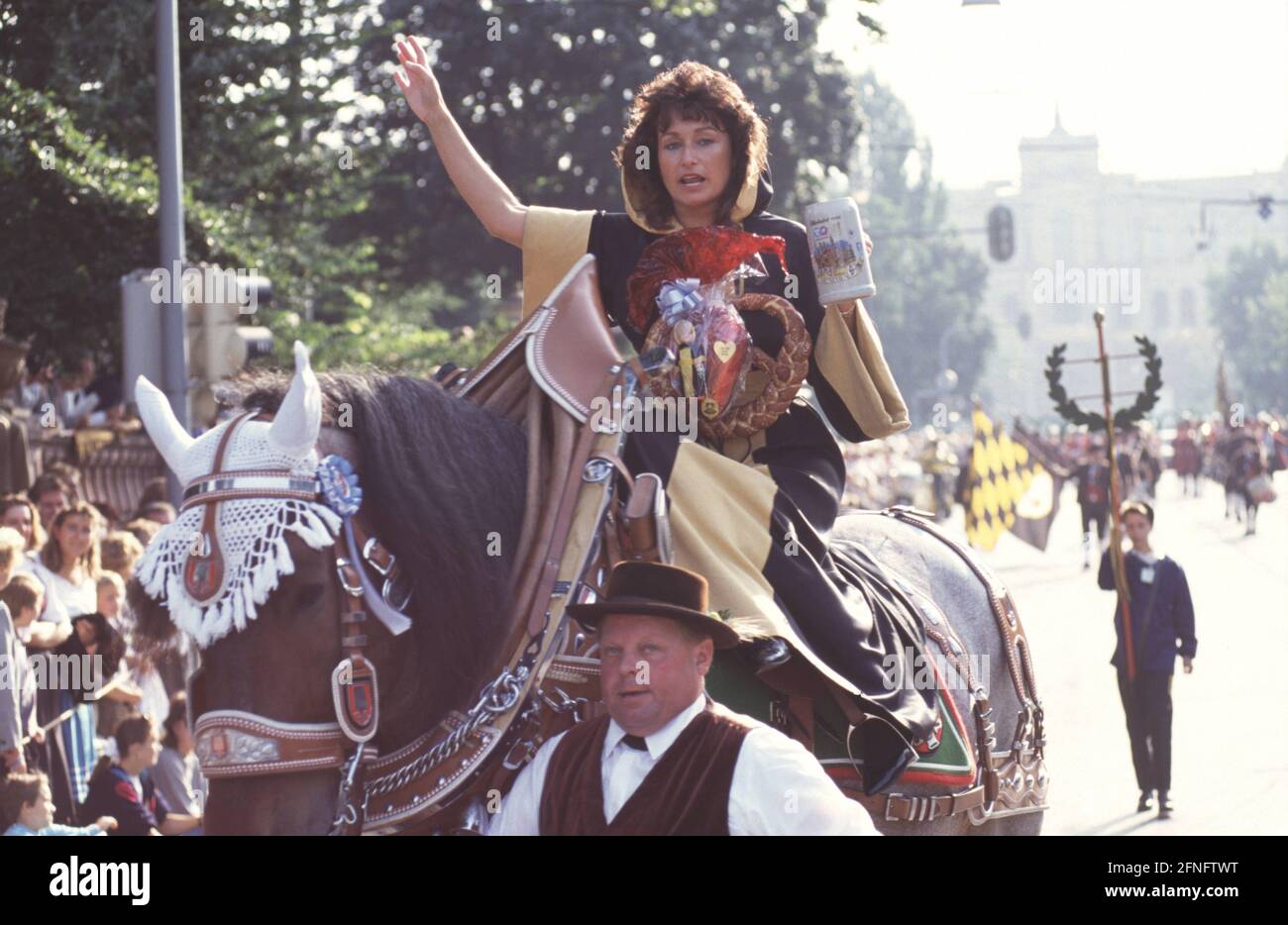 The Münchner Kindl Manuela Weitner rides on a horse at the traditional ...