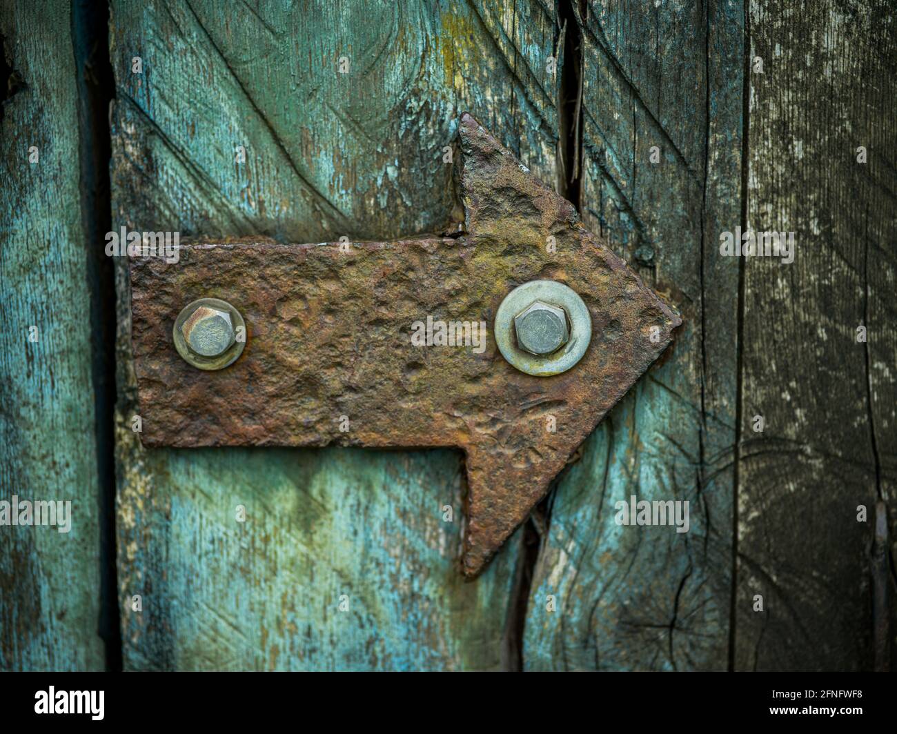 Detail of an arrow over a vintage blue wood texture Stock Photo - Alamy