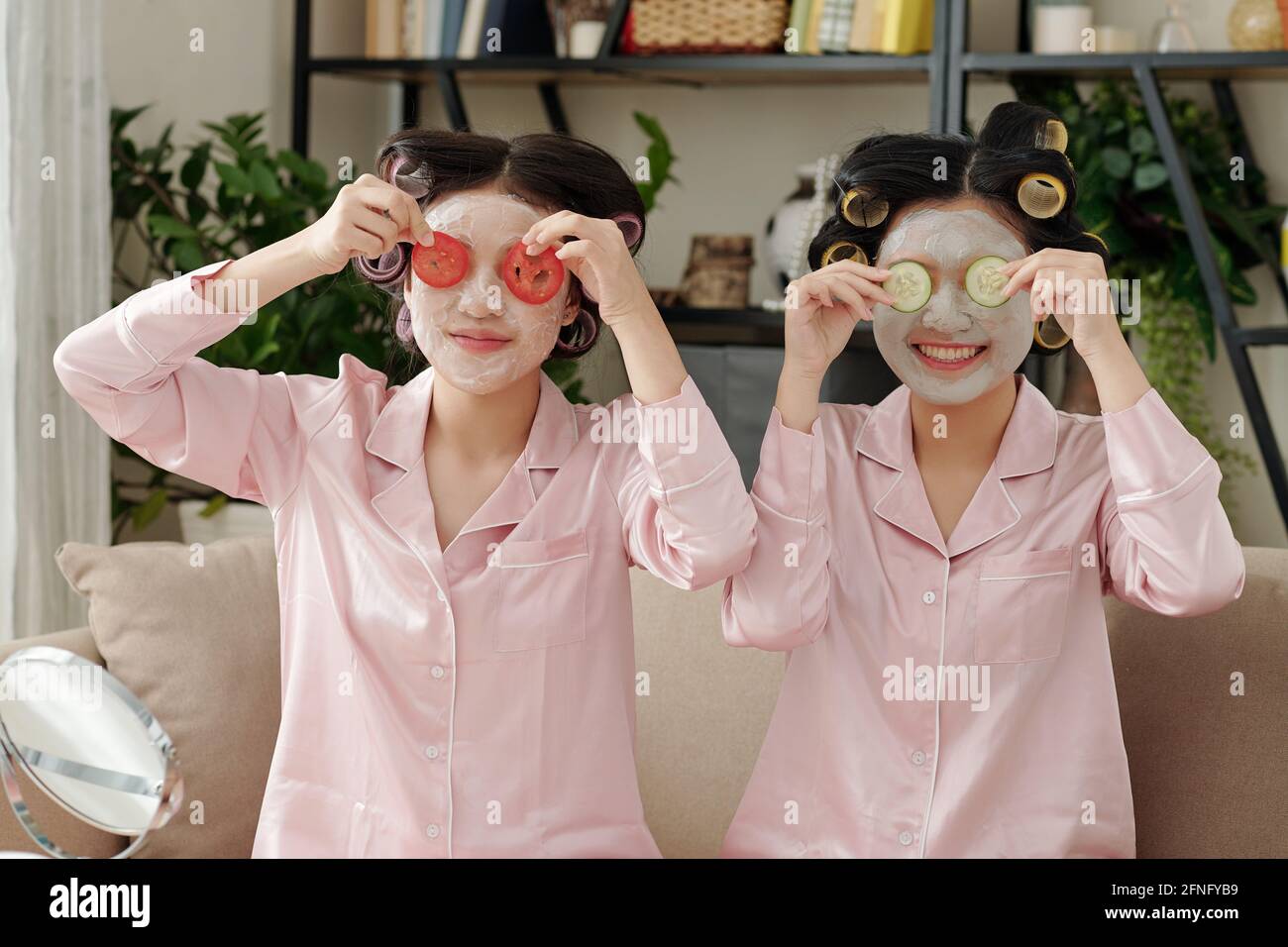Young women covering faces masks hi-res stock photography and images ...
