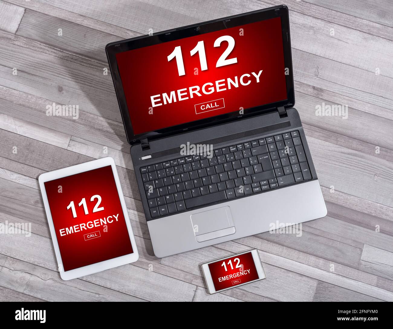 Emergency concept shown on different information technology devices ...