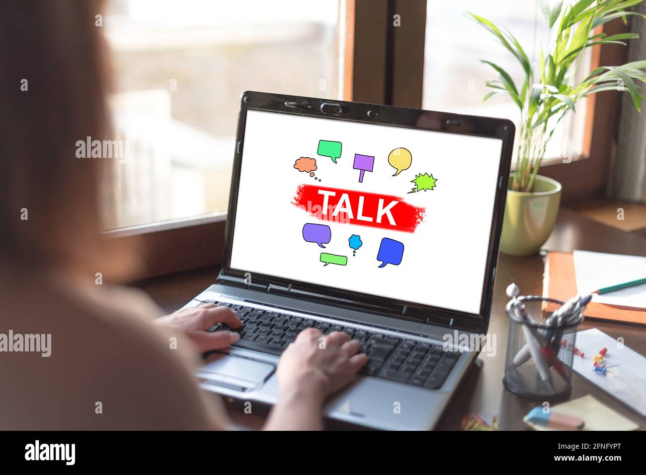 Laptop screen displaying a talk concept Stock Photo - Alamy
