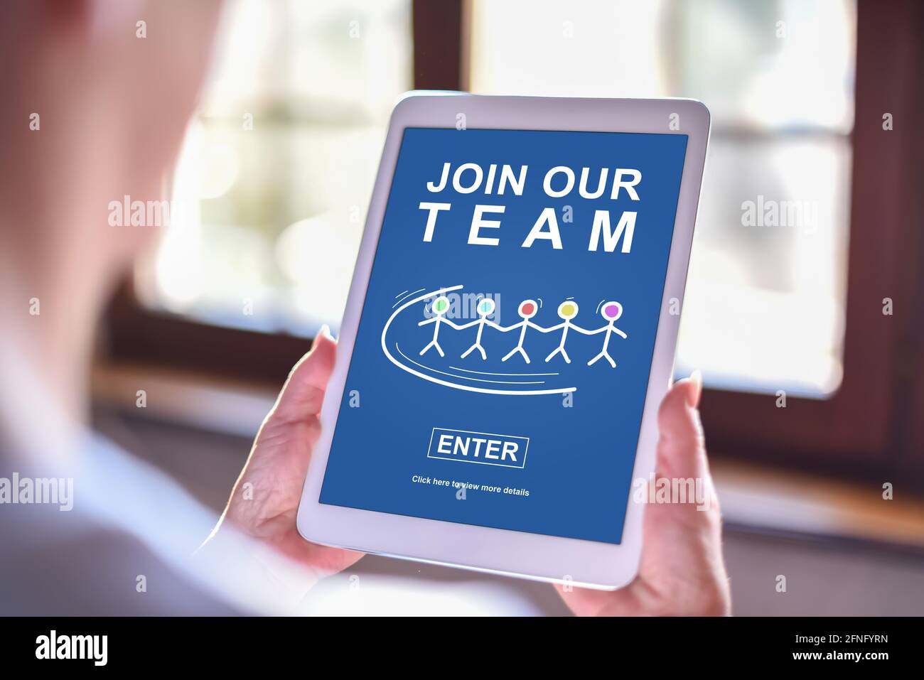 Tablet screen displaying a join our team concept Stock Photo - Alamy