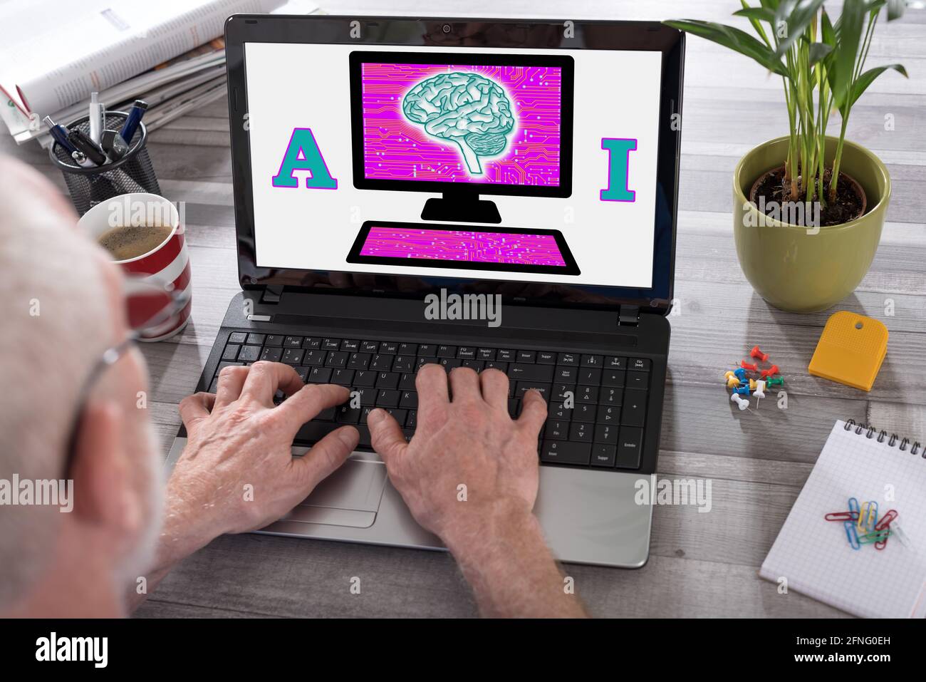 Artificial intelligence concept shown on a laptop used by a man Stock ...