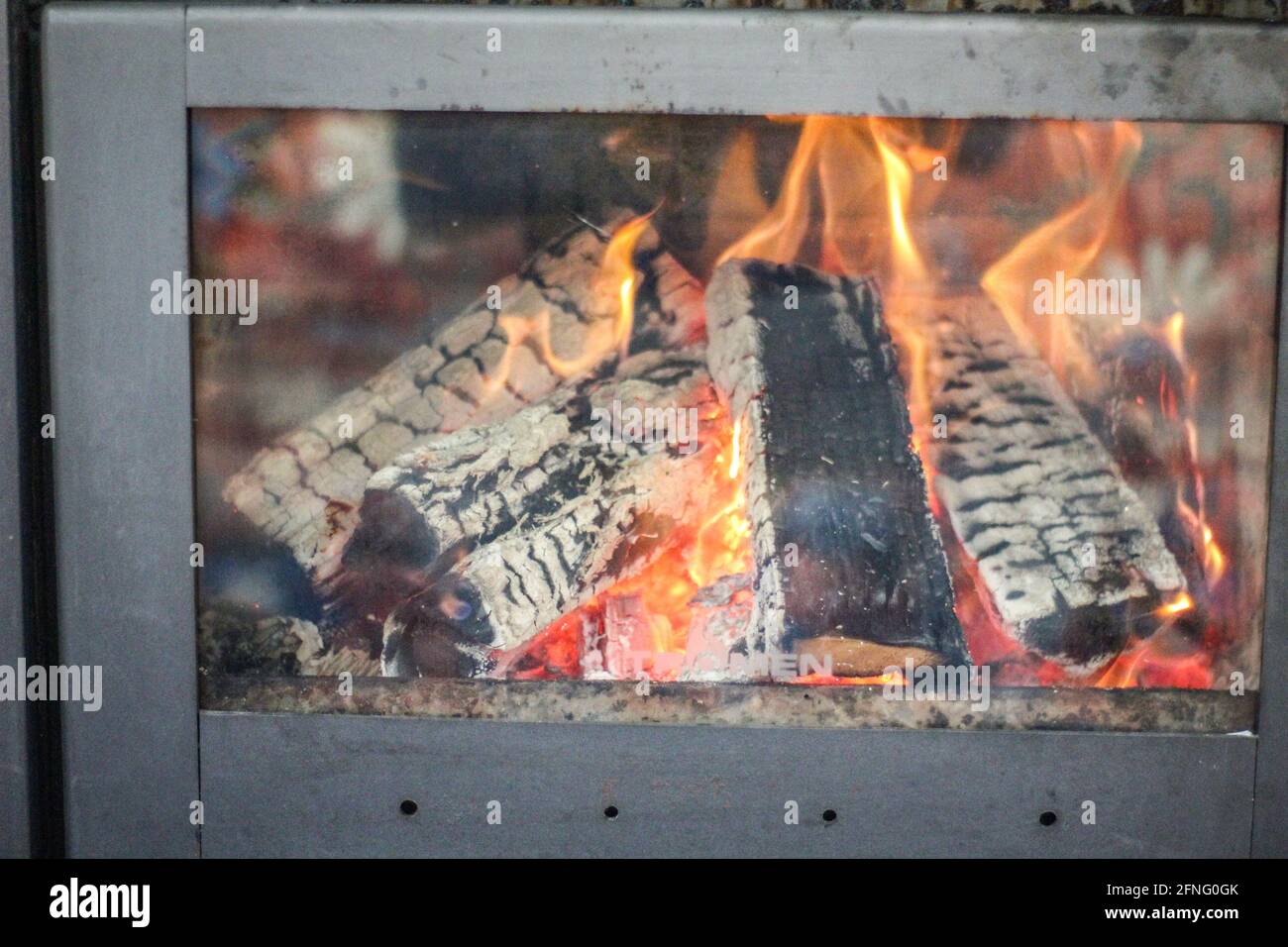 Closeup of burning woods inside an oven Stock Photo - Alamy