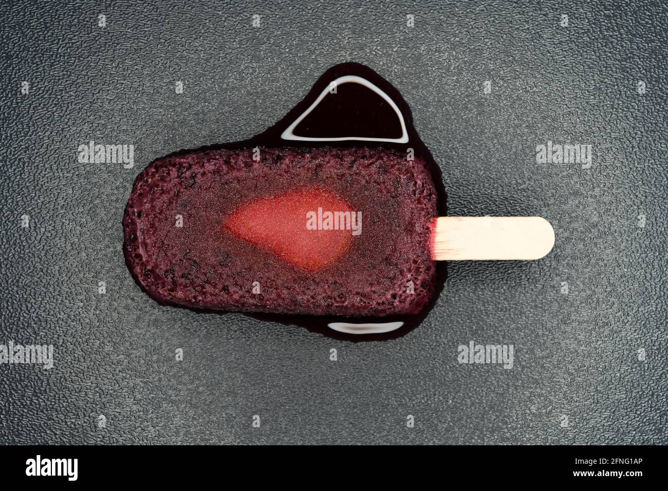 top view mulberry and blueberry flavor popsicle with slice of ...