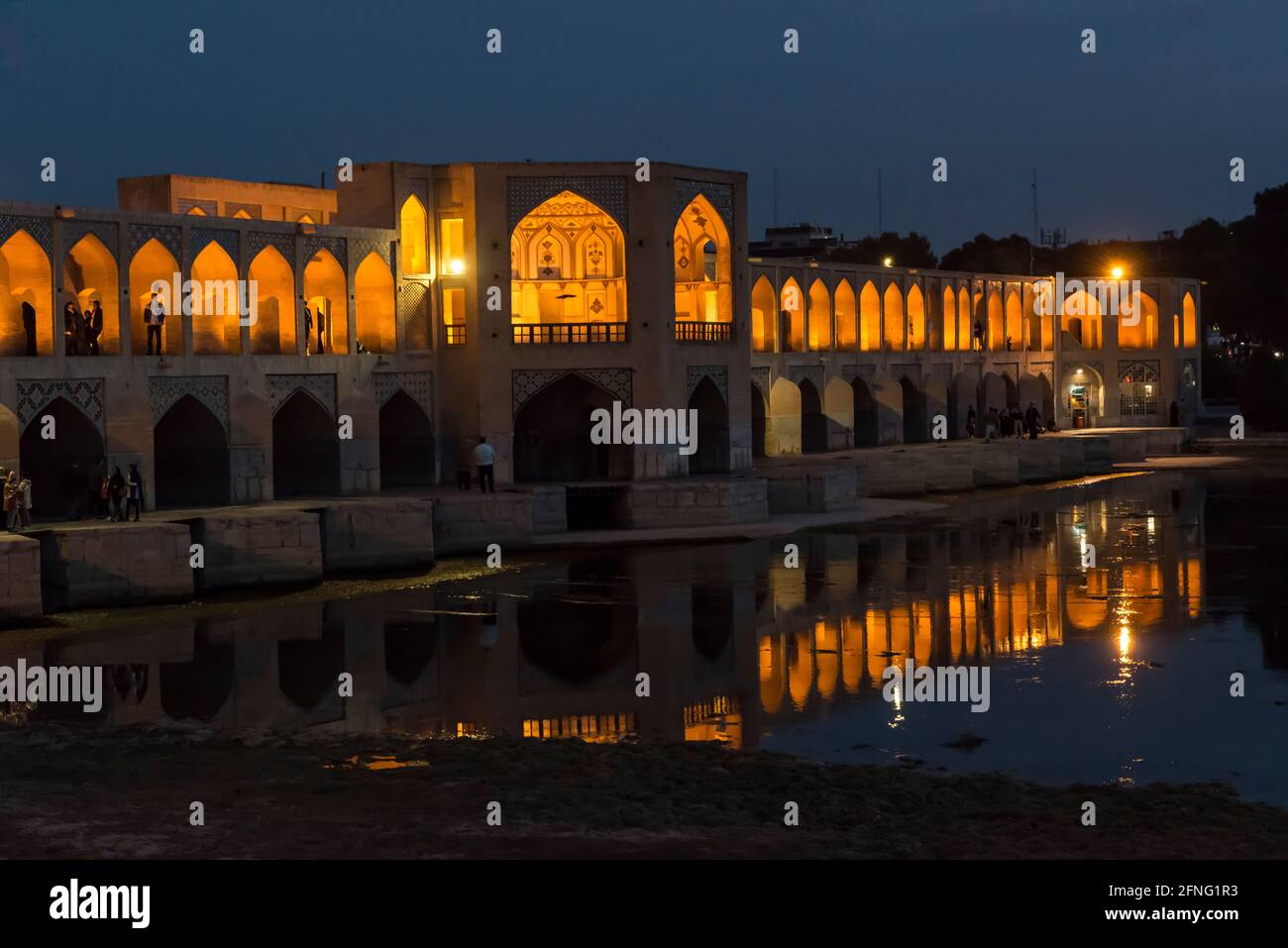 The historic Khaju bridge over the Zayanderud river illuminated for the ...