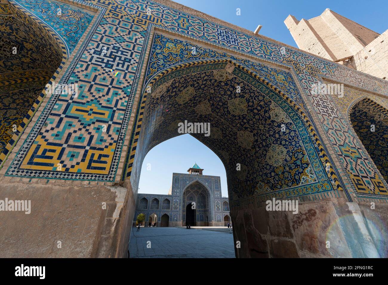 Shah Mosque. View from the arcade of the courtyard and the west iwan ...