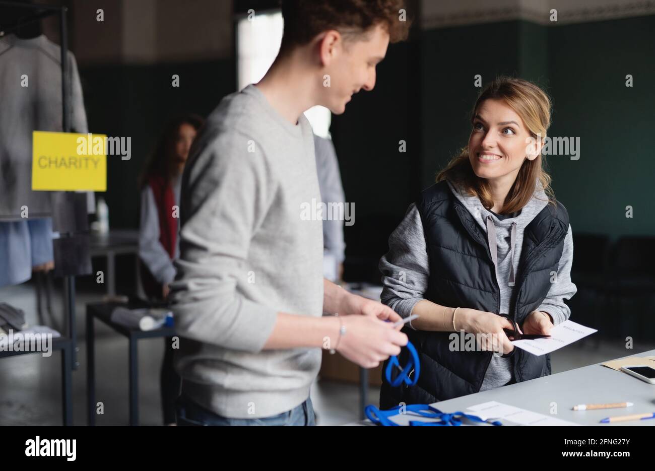 Group of volunteers working in community charity donation center ...