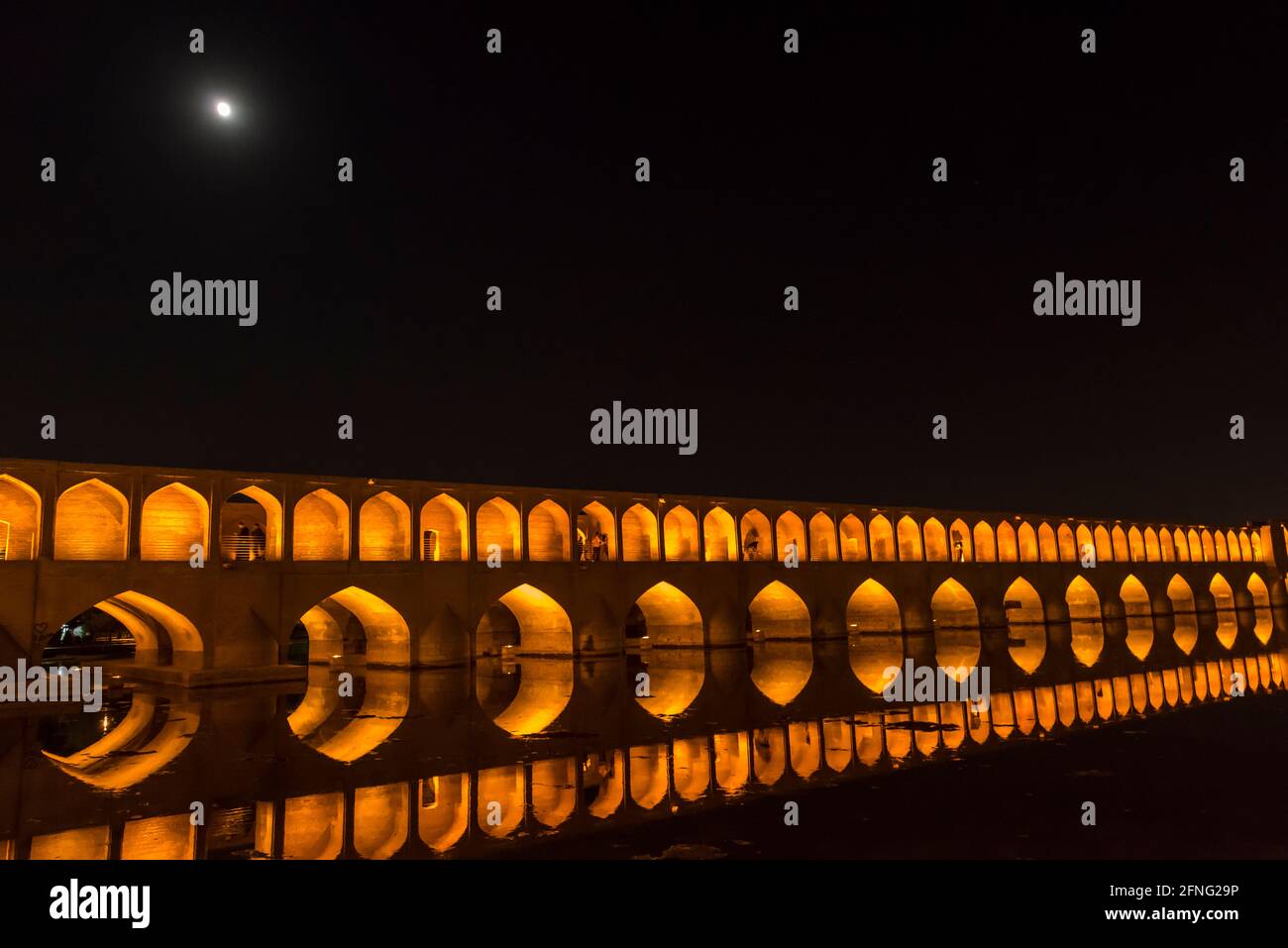 Full moon above the Illuminated Siosepol bridge, one of the historical ...