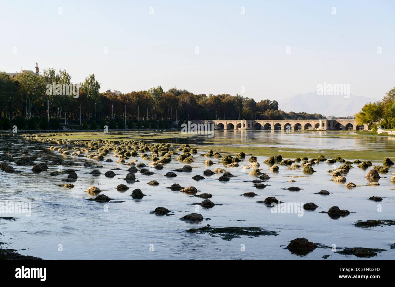 Small earthen islands in the shallow water of the Zayanderud river ...