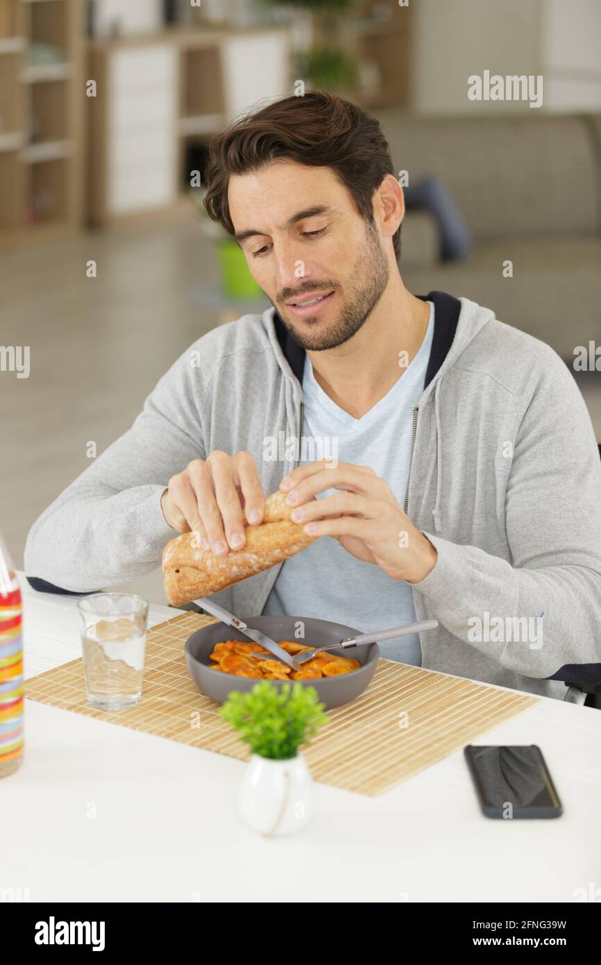 disabled man making sandwich in kitchen Stock Photo - Alamy