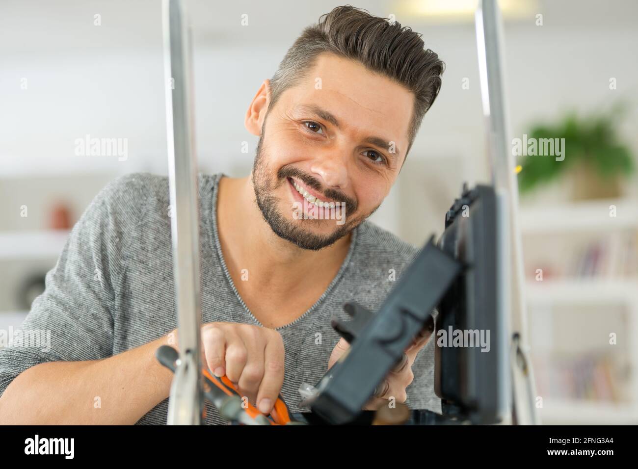 positive young man with tools Stock Photo - Alamy