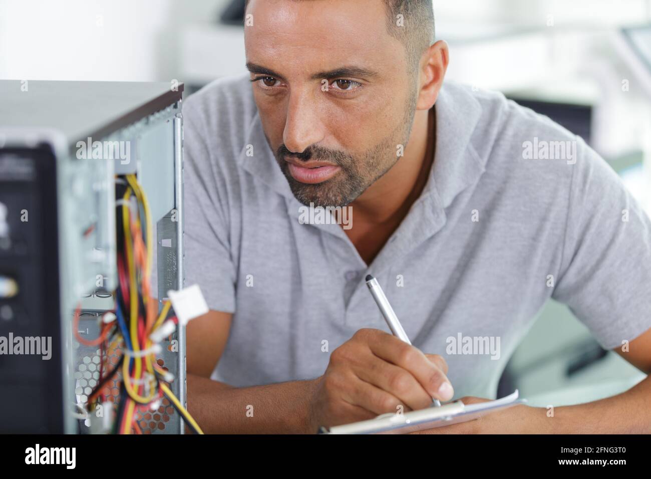 technician analysing a pc computer Stock Photo - Alamy