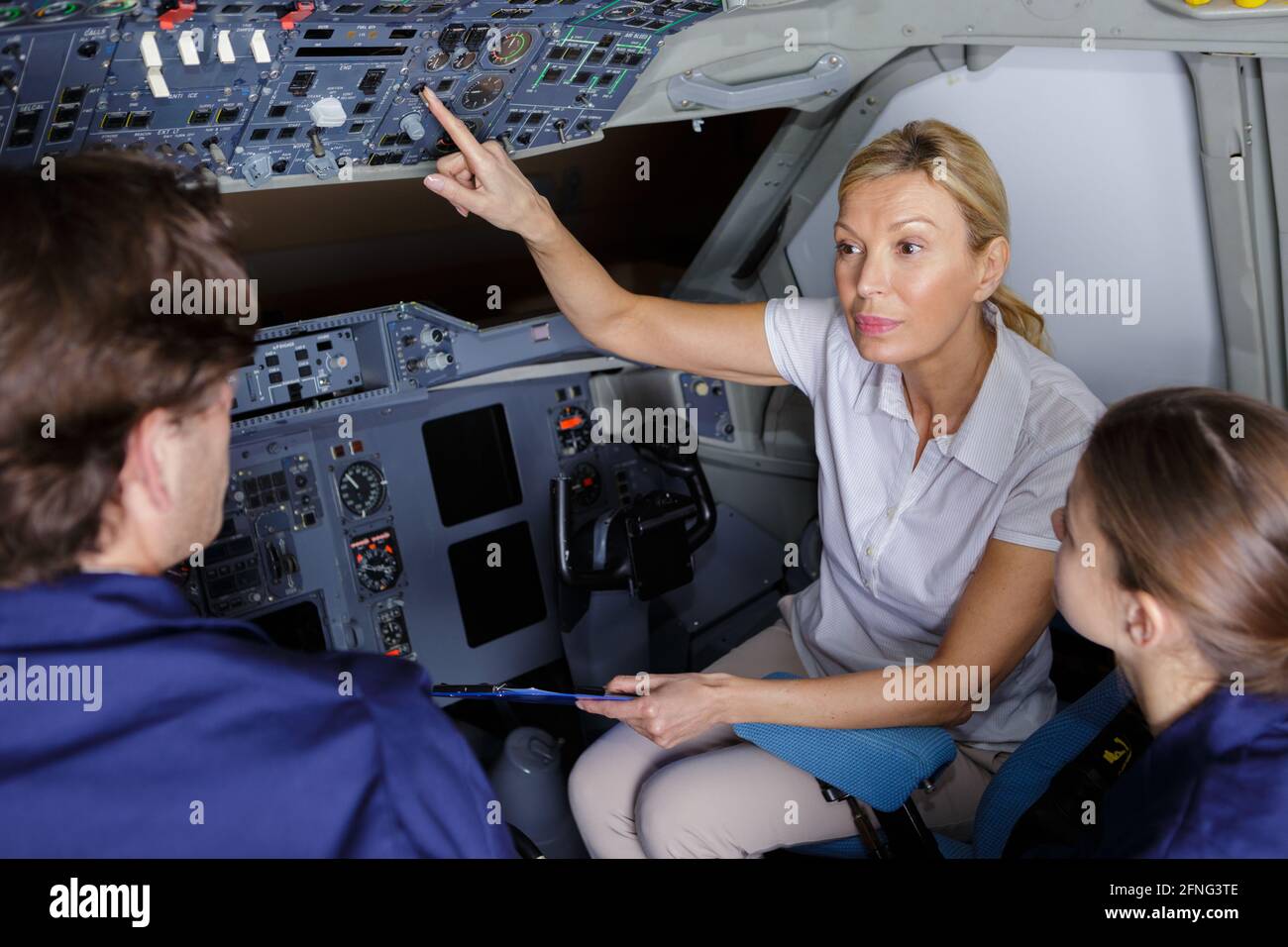Female airline pilot in cockpit hi-res stock photography and images - Alamy