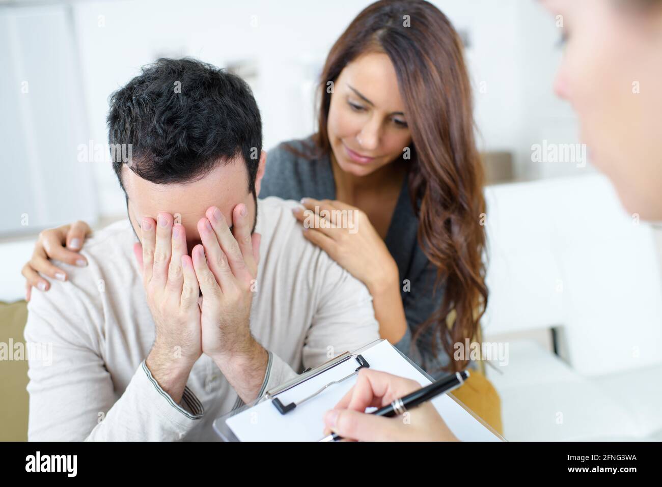woman supporting a sad man Stock Photo - Alamy
