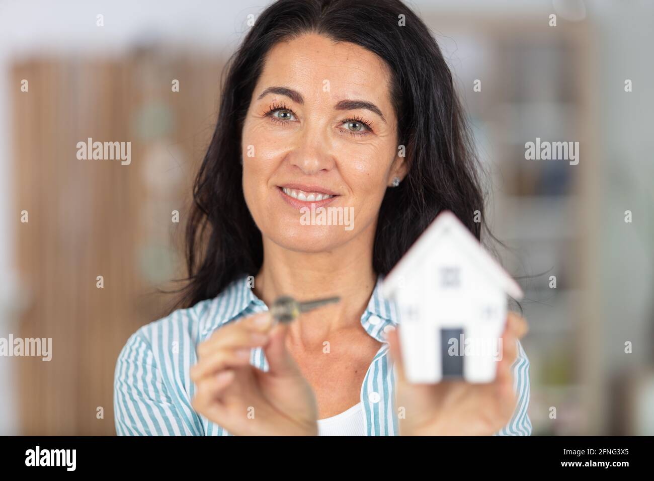 woman holds mockup home and keys Stock Photo - Alamy