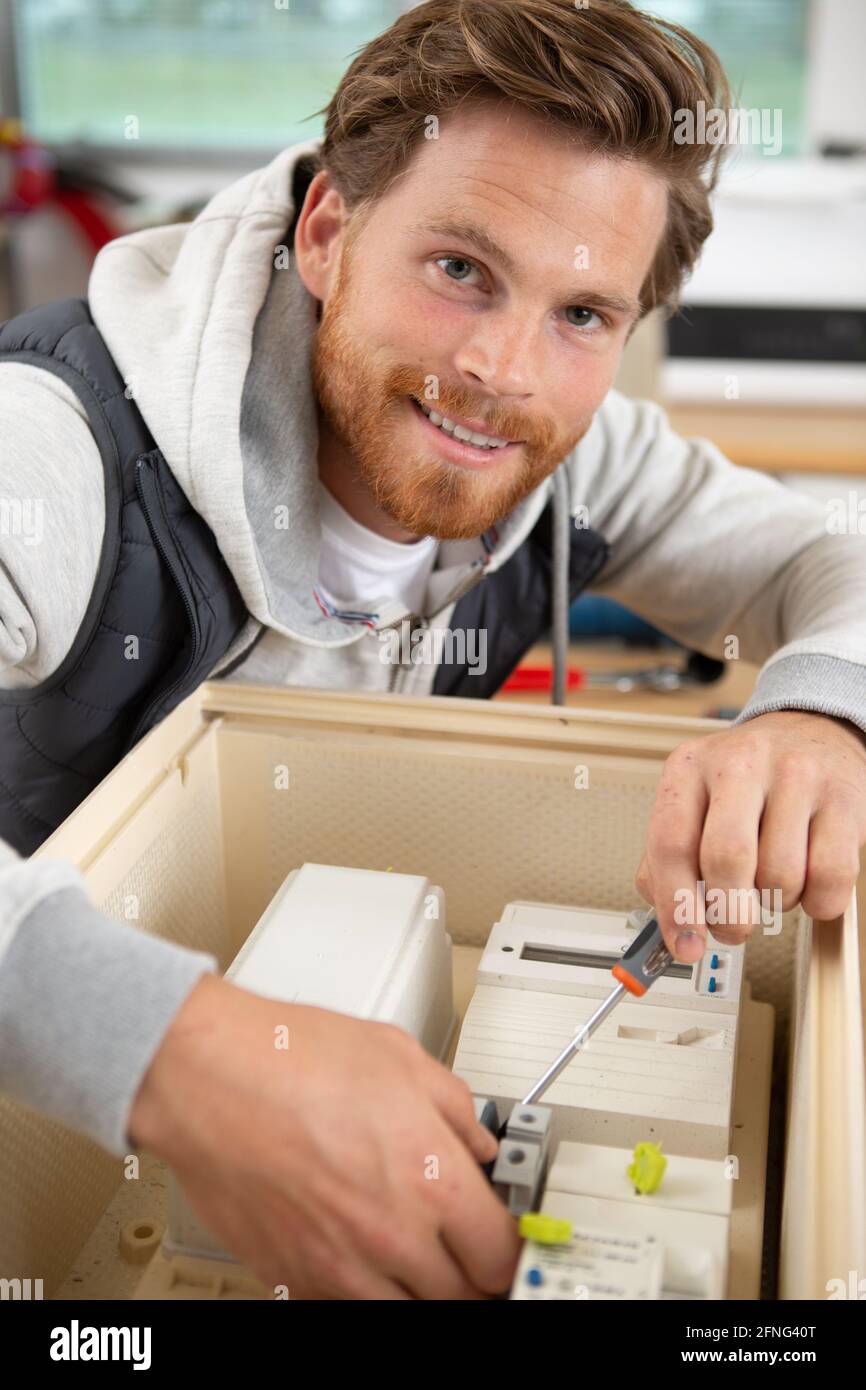 Person fixing an office chair hi-res stock photography and images - Alamy