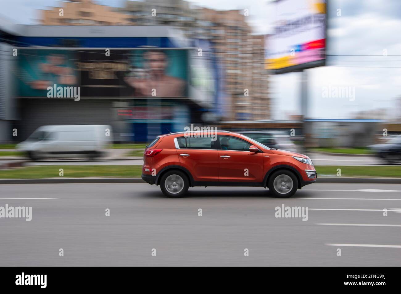 Ukraine, Kyiv - 26 April 2021: Red KIA Sportage car moving on the ...