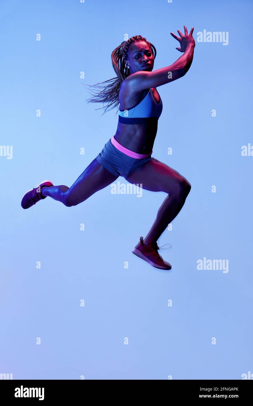 Full body young african woman jump hi-res stock photography and images ...