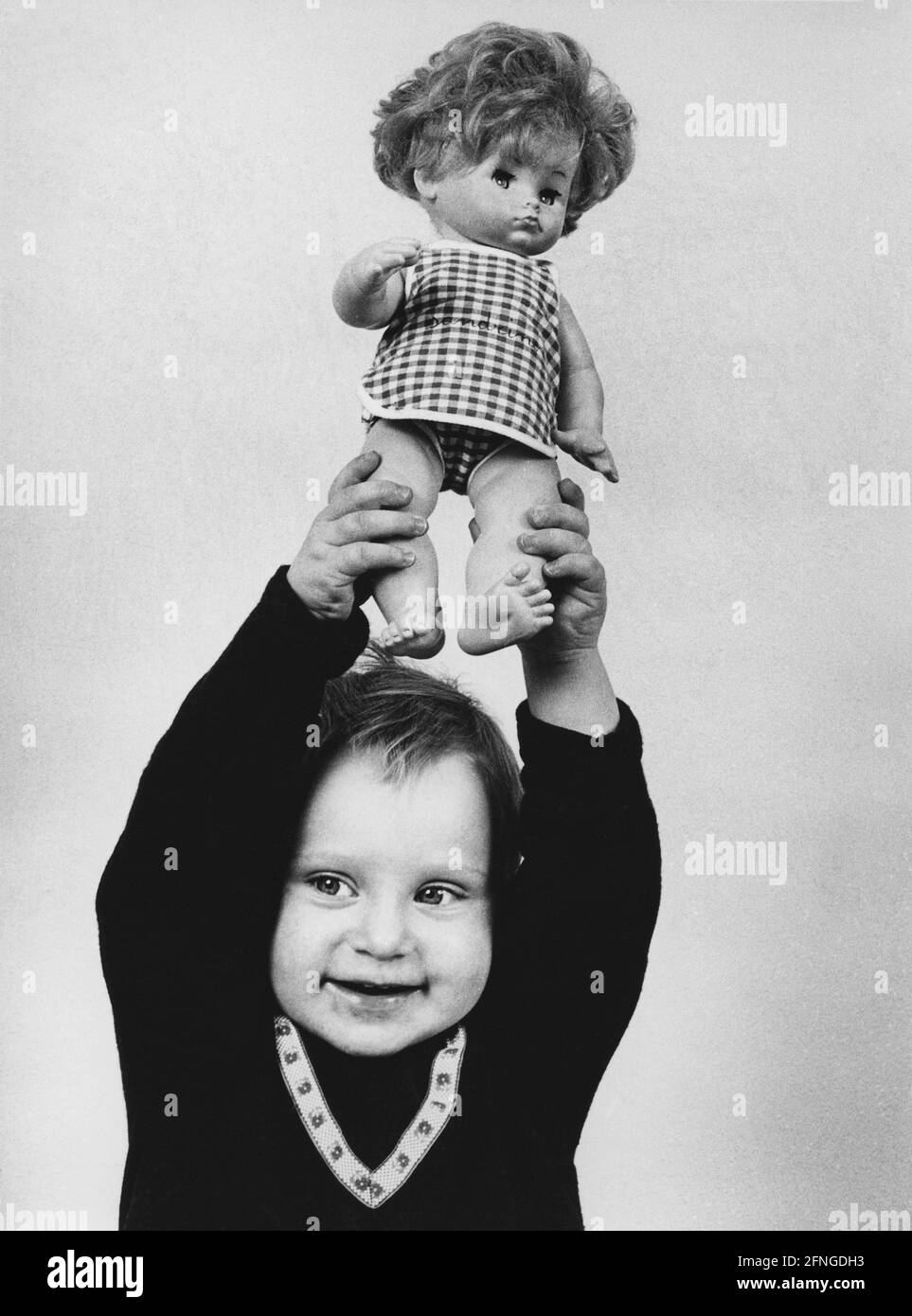 Little girl presents her doll, 60s [automated translation] Stock Photo ...
