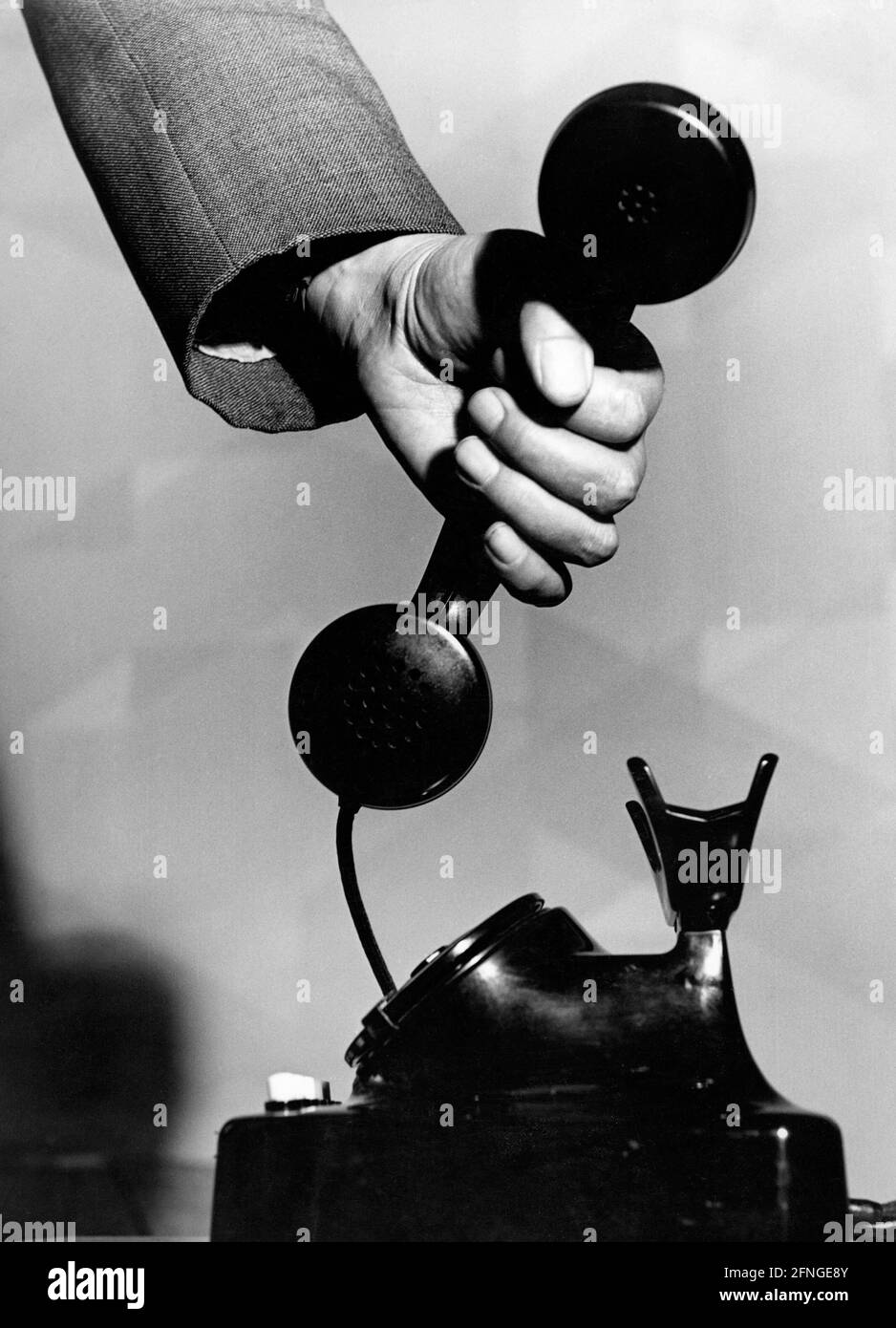 Man hand puts receiver dial telephone hi-res stock photography and ...