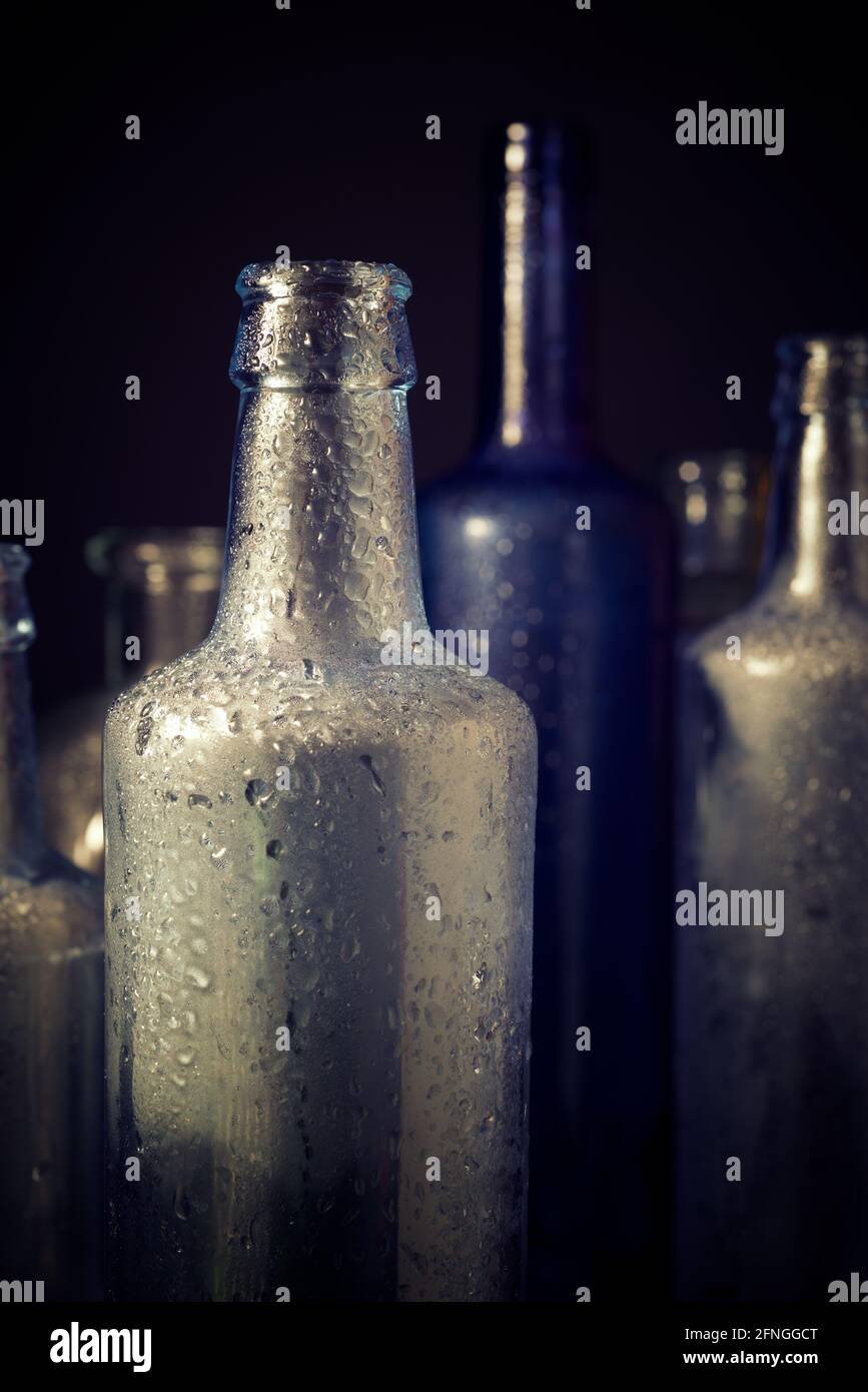 Glass bottles on a table Stock Photo - Alamy
