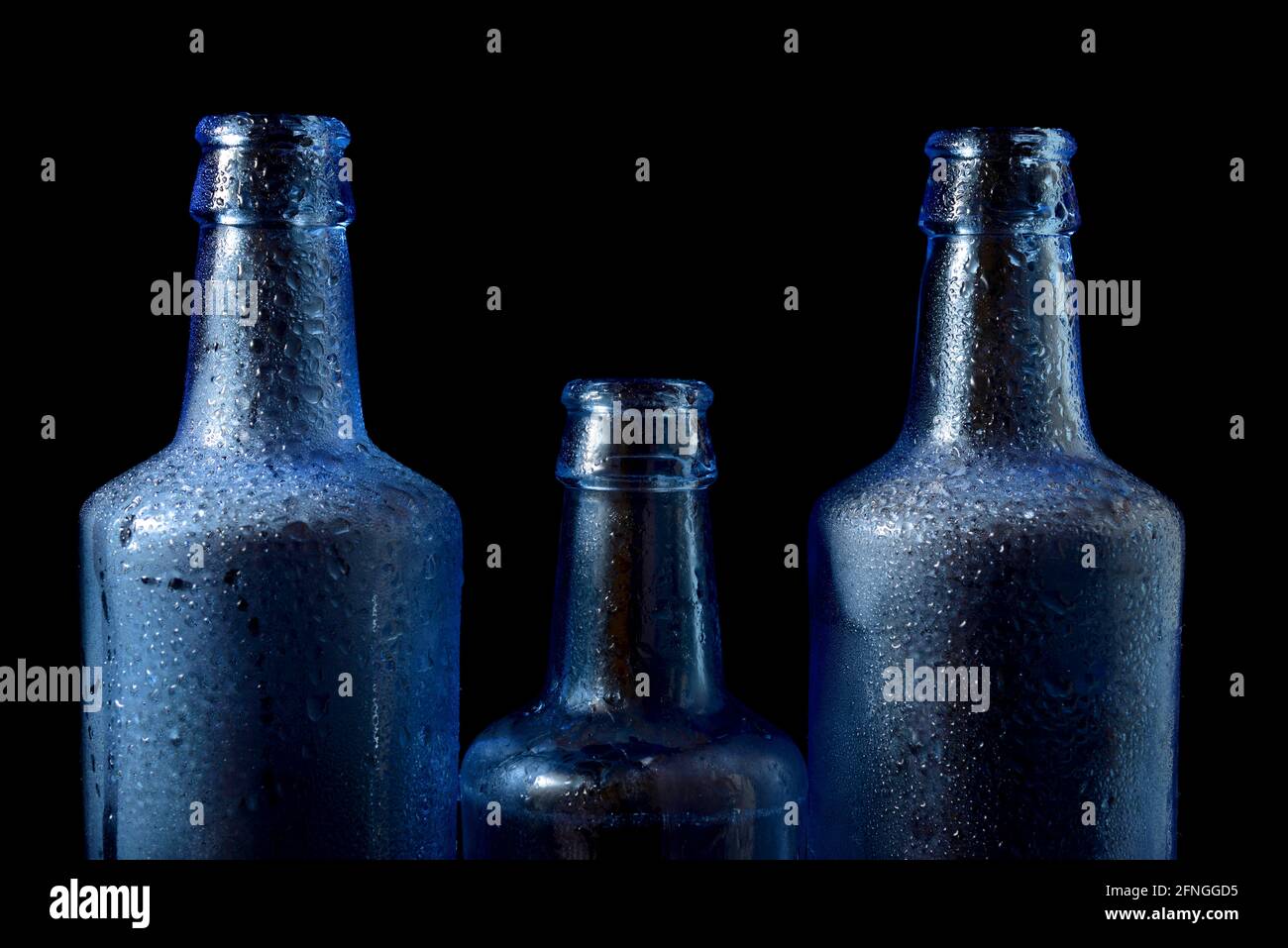 Glass bottles on a table Stock Photo - Alamy