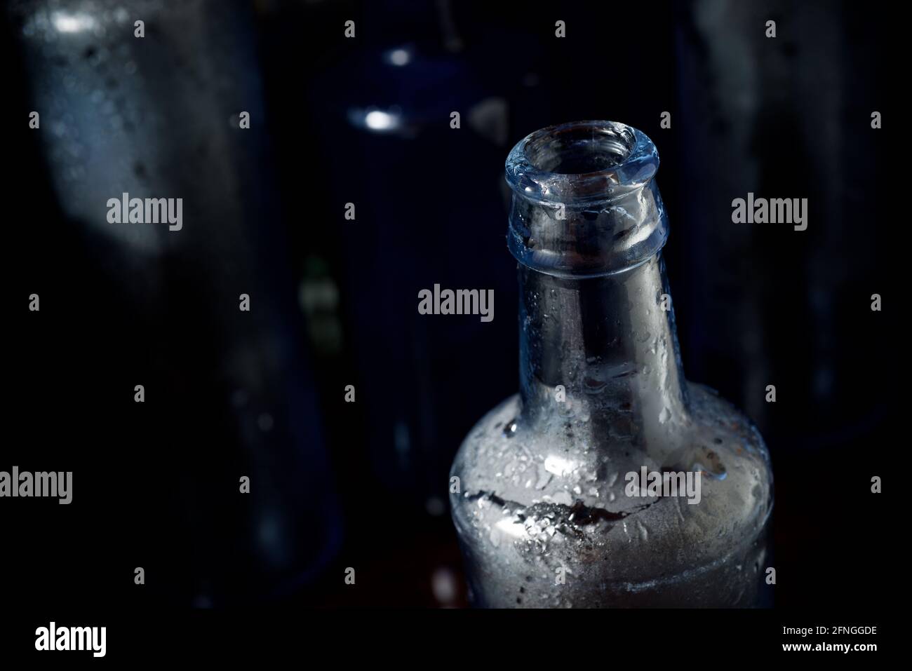 Glass bottles on a table Stock Photo - Alamy