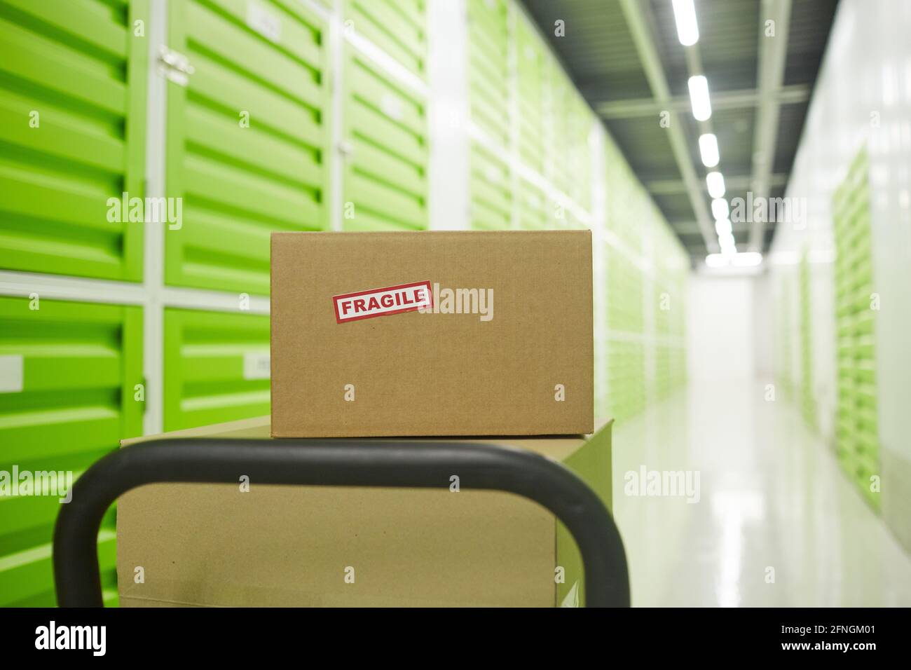 Close-up of cardboard boxes on trolley in the warehouse Stock Photo - Alamy