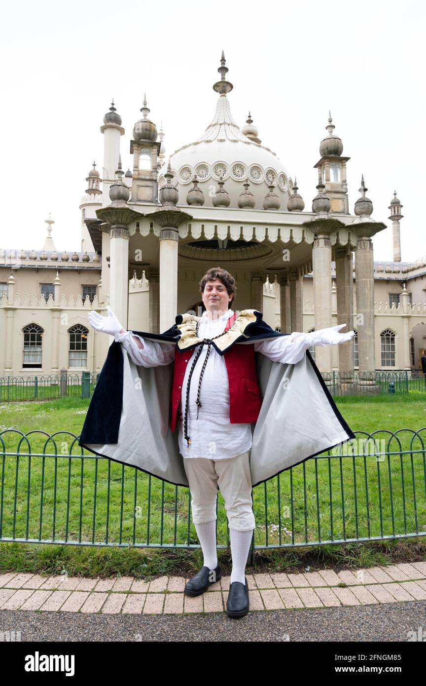 Brighton UK 17th May 2021 - A member of staff dressed in character as ...