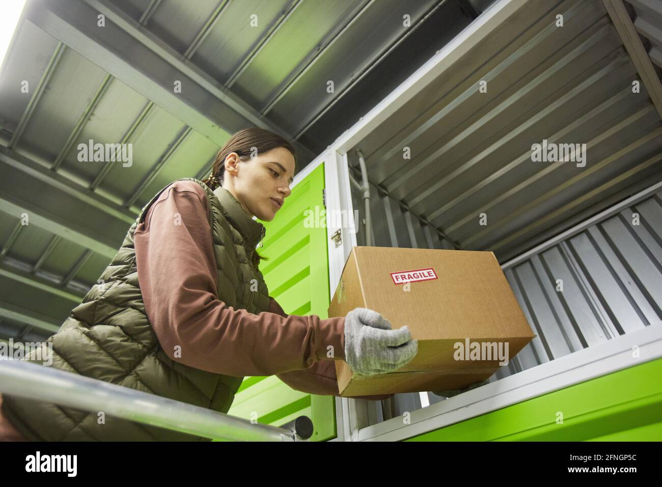 Female worker packing box in warehouse hi-res stock photography and ...