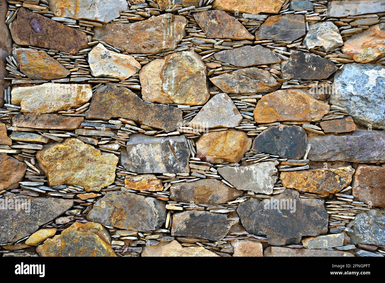 Rustic ancient handcrafted stone wall in the ghost town of Real de ...