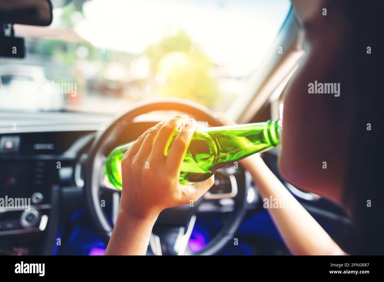 Hand holding beer bottle driving hi-res stock photography and images ...