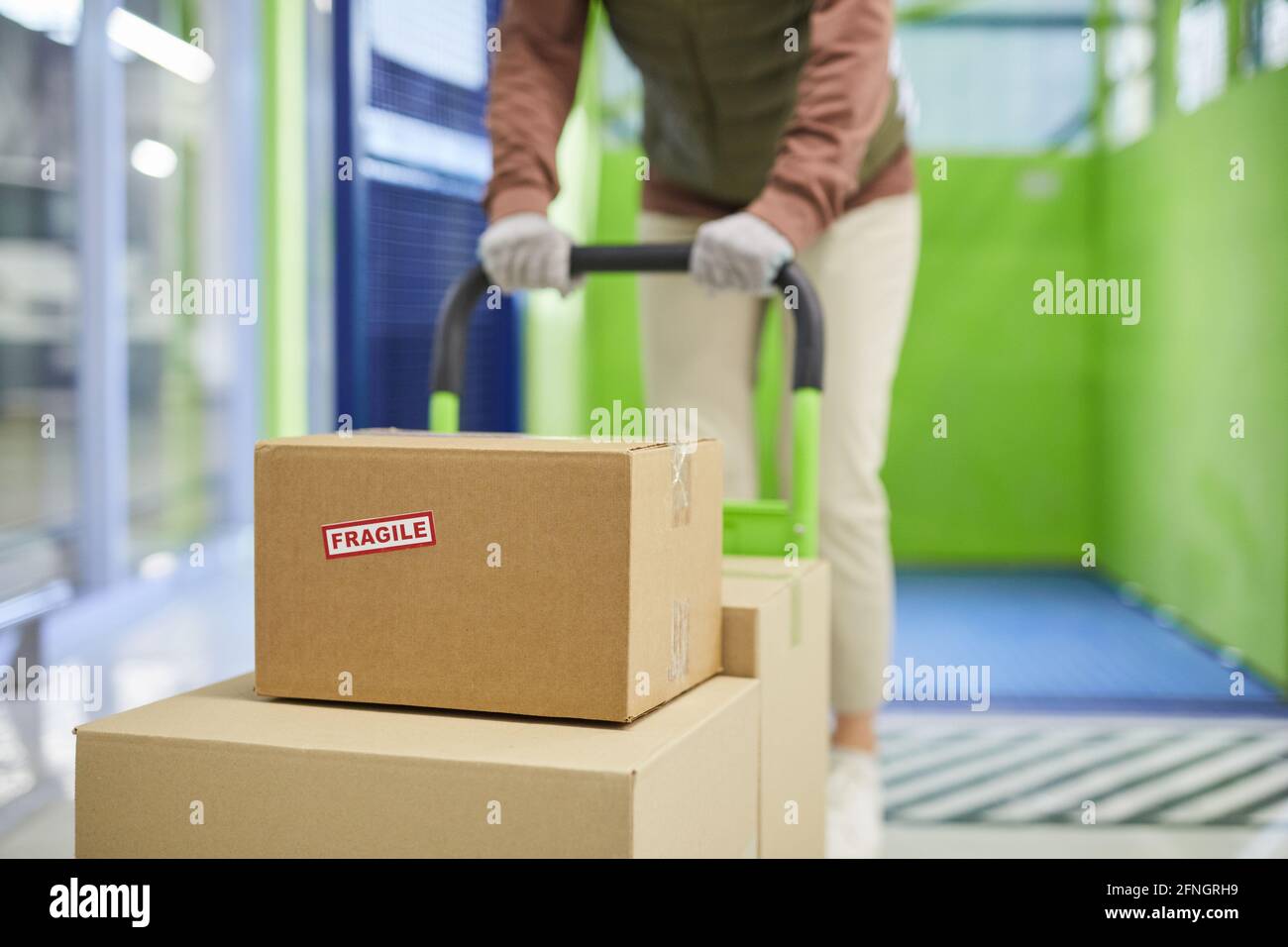 Warehouse pushing trolley hi-res stock photography and images - Alamy