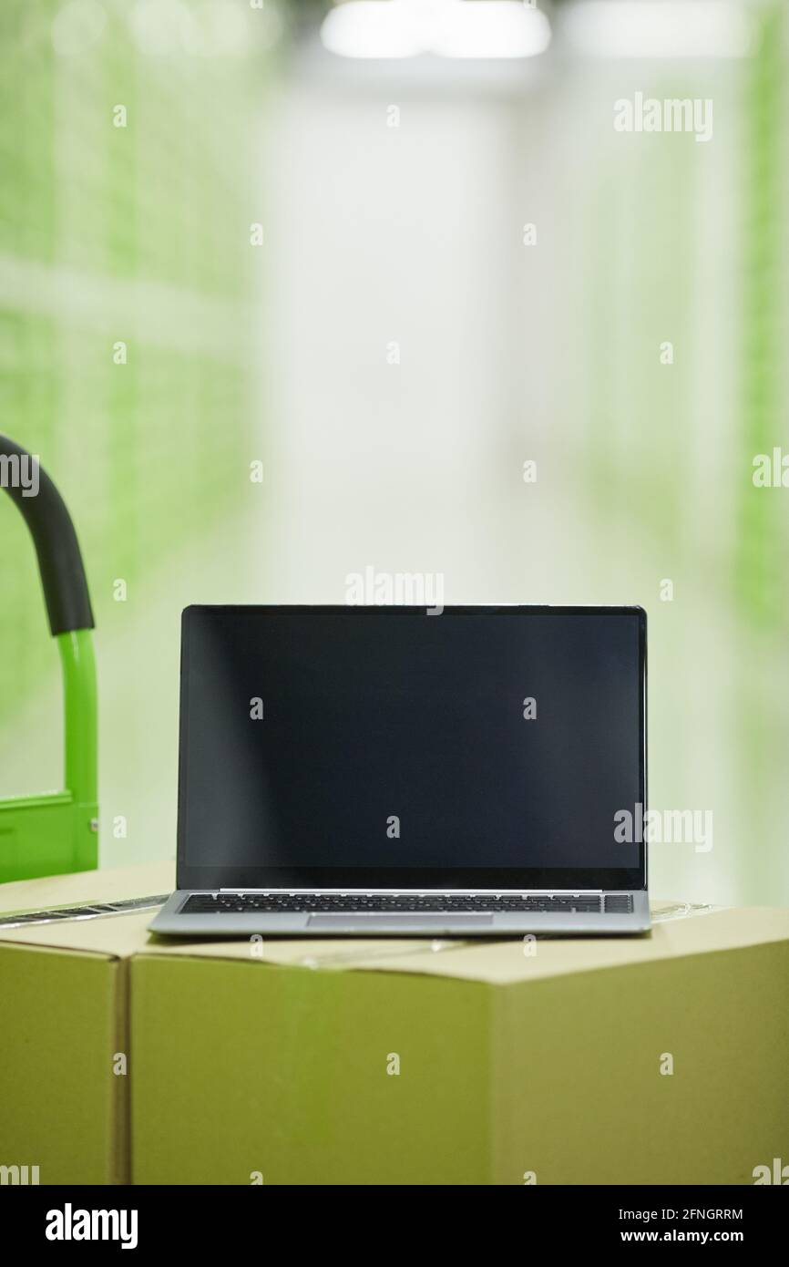 Close-up of laptop on the stack of boxes for online delivery Stock ...
