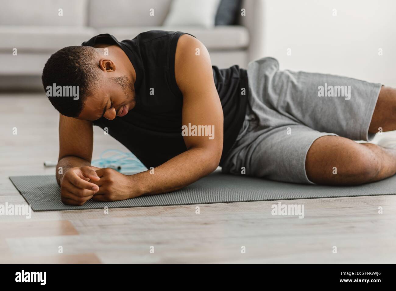 Black Fitness Man Feeling Bad During Workout Exercising At Home Stock ...